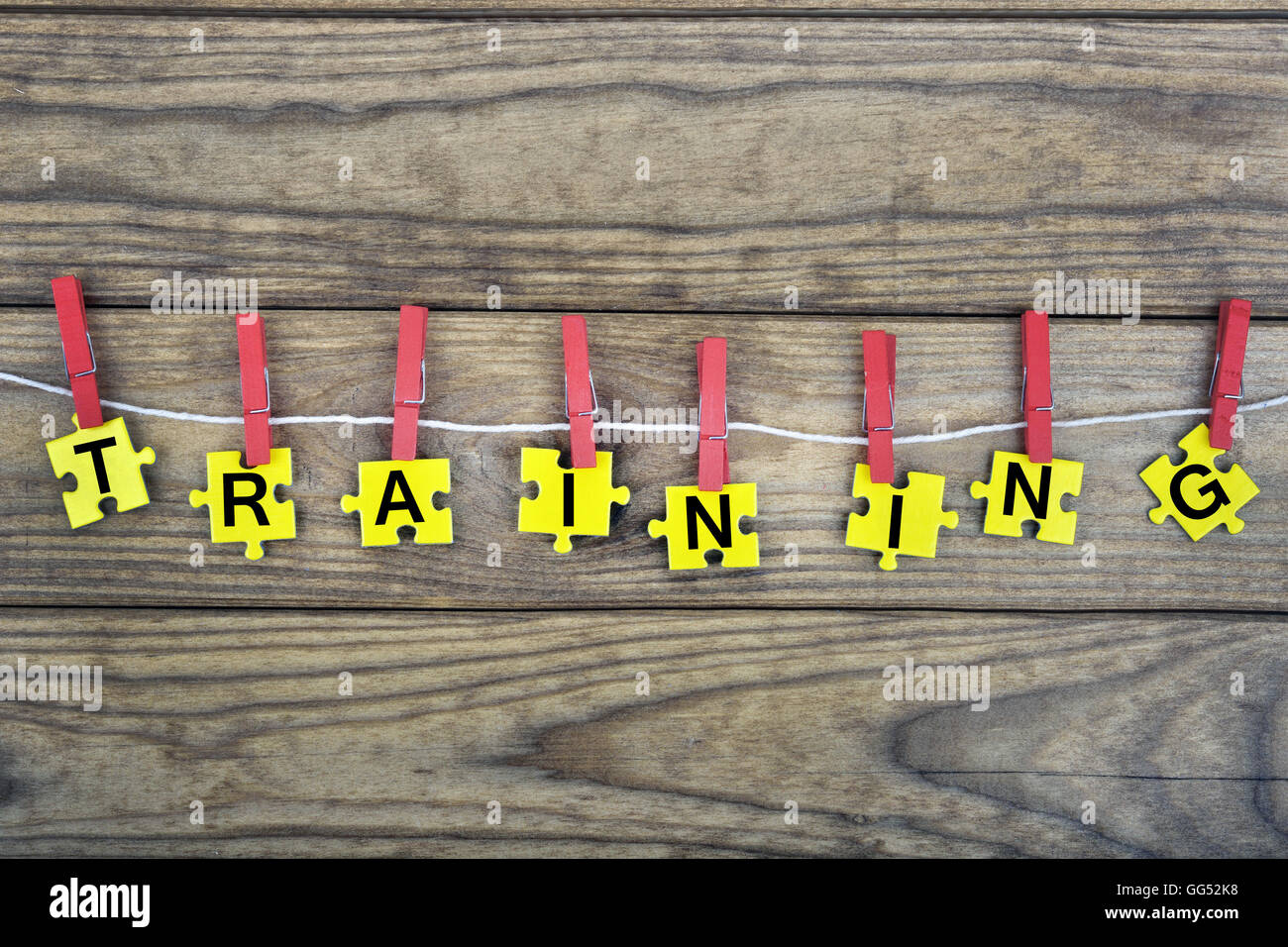 Puzzle pieces with word Training Stock Photo - Alamy