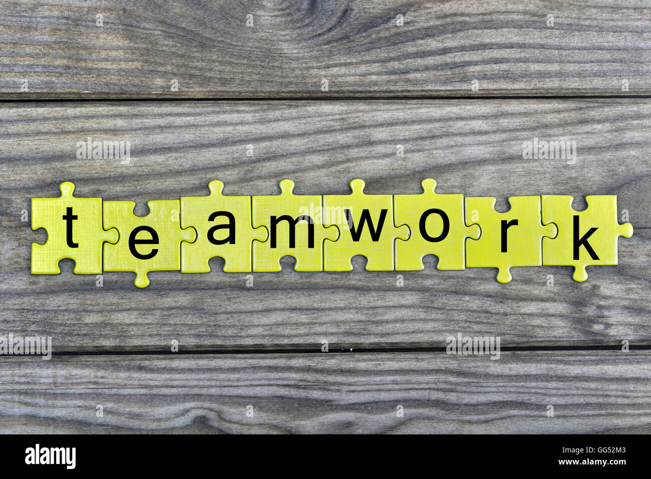 Puzzle pieces with word Teamwork Stock Photo - Alamy