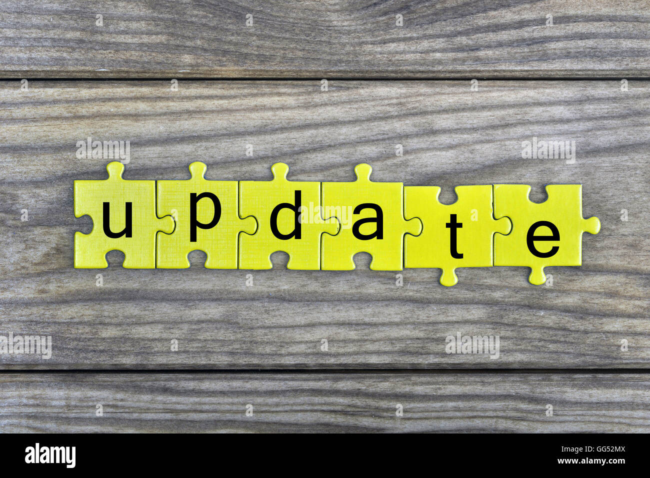 Puzzle pieces with word Update Stock Photo - Alamy