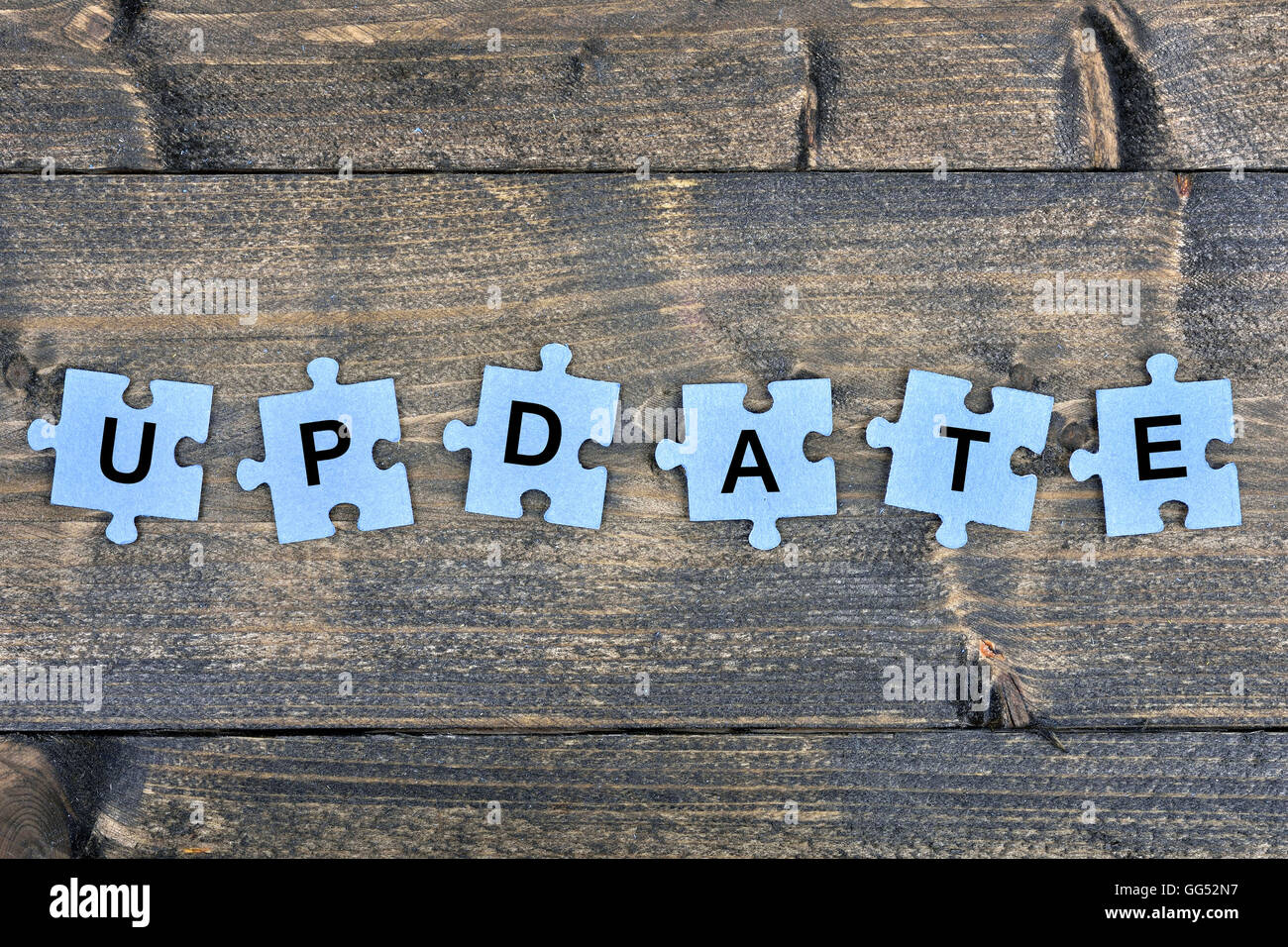 Puzzle pieces with word Update Stock Photo - Alamy