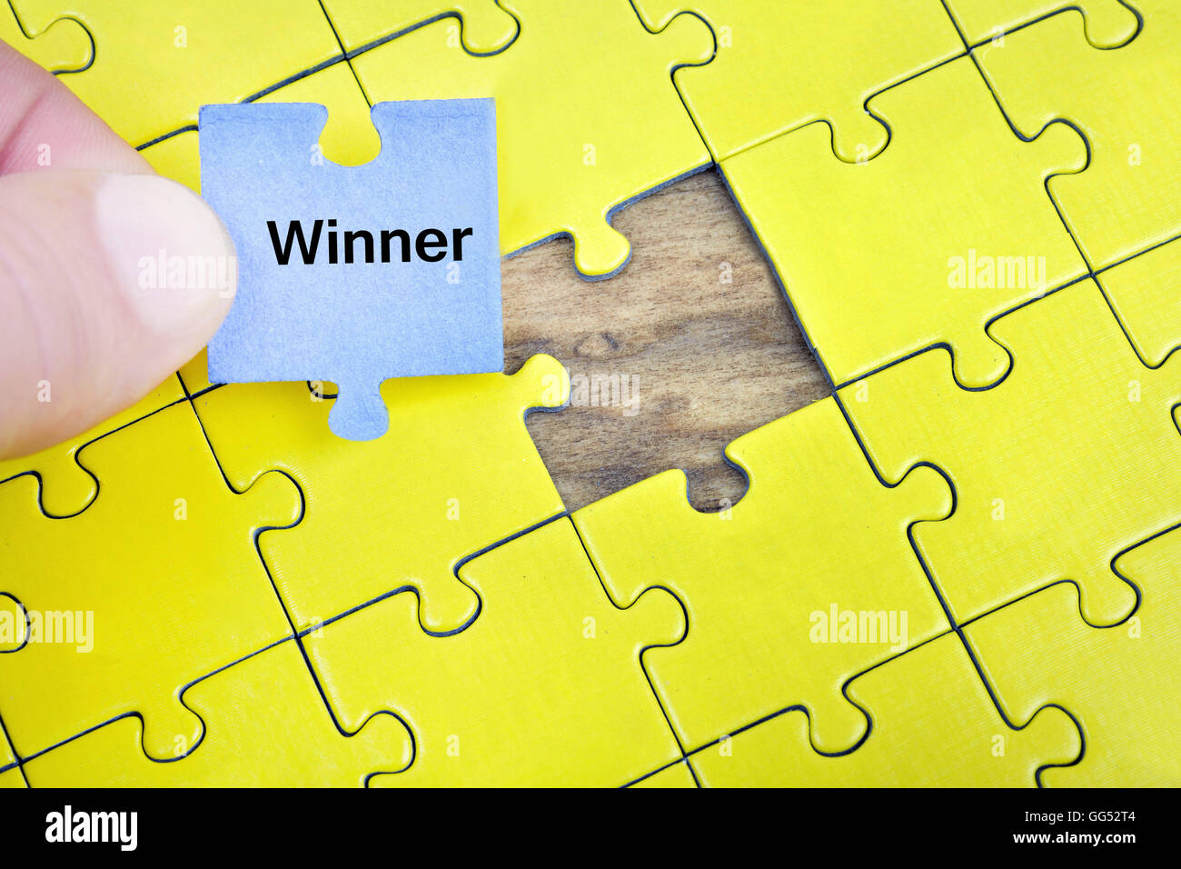 Puzzle pieces with word Winner Stock Photo - Alamy