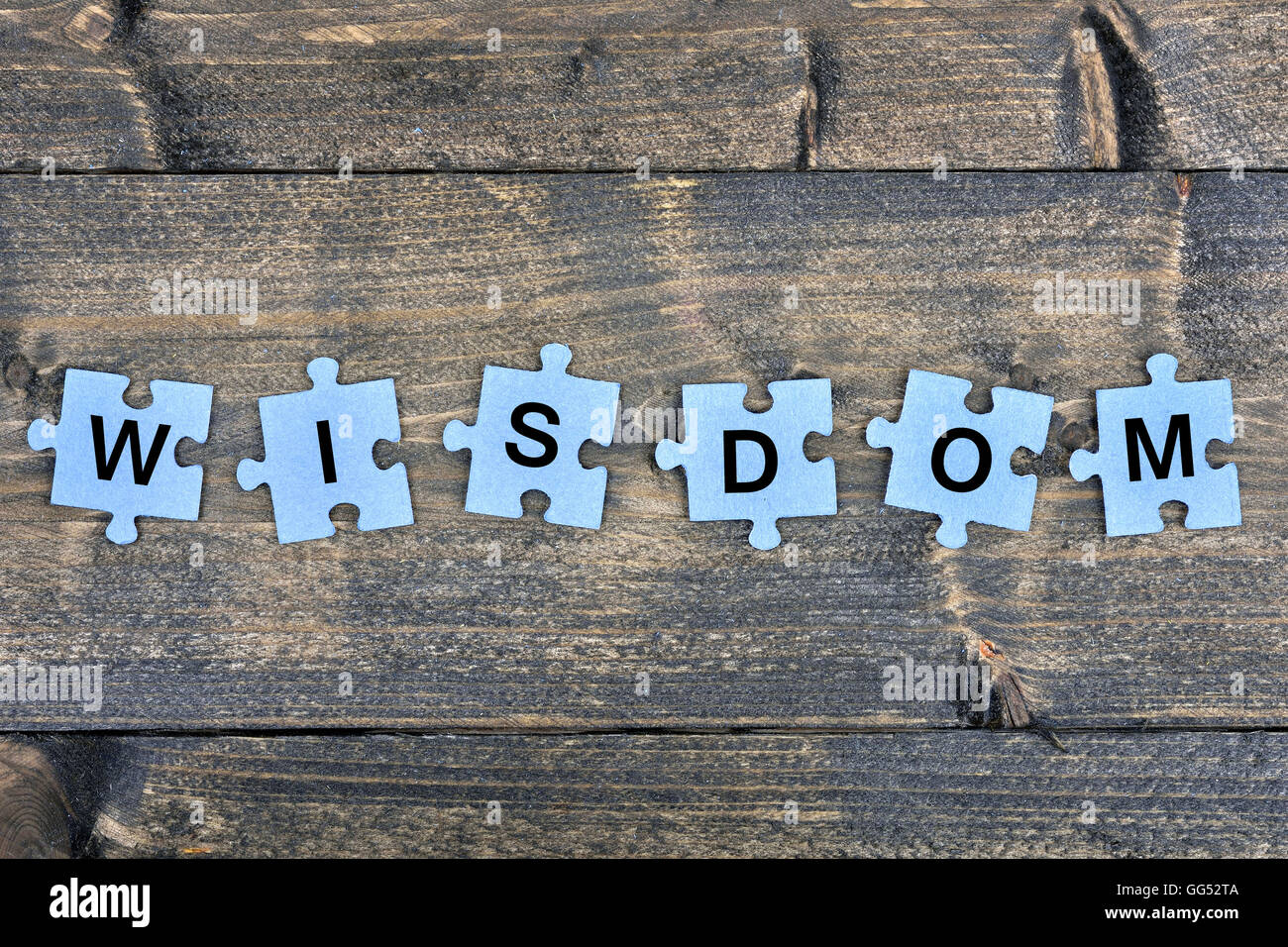 Puzzle pieces with word Wisdom Stock Photo - Alamy