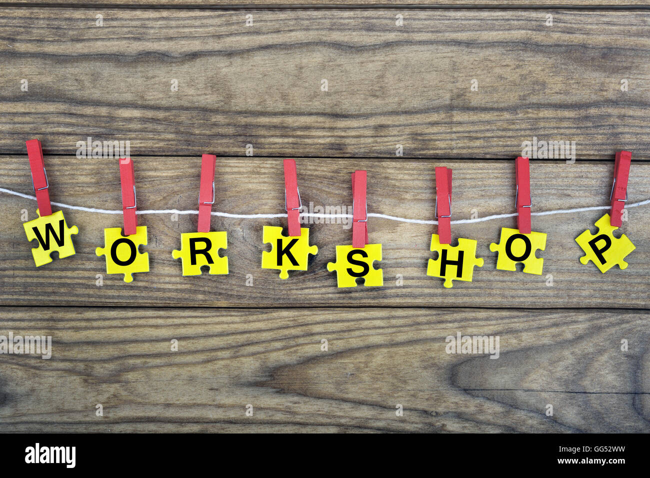 Puzzle pieces with word workshop Stock Photo - Alamy