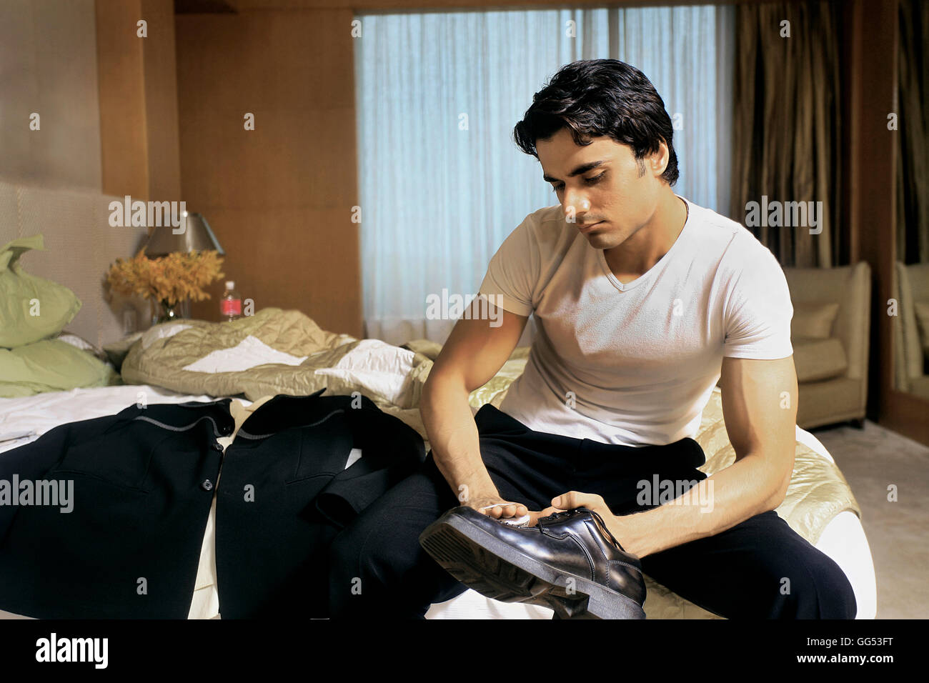 A man cleaning his shoe Stock Photo - Alamy