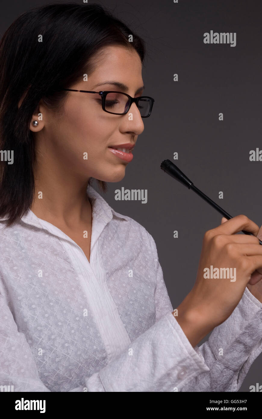 Person speaking into microphone hi-res stock photography and images - Alamy