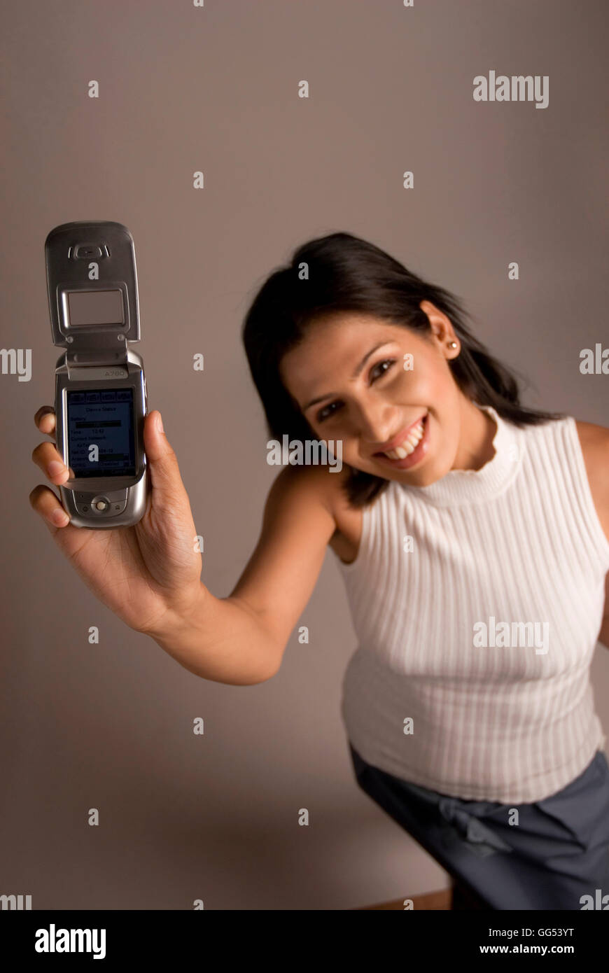 Woman holding a phone Stock Photo - Alamy