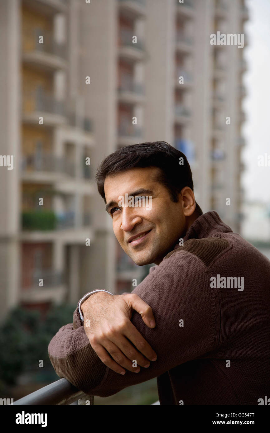 Indian man on balcony of house hi-res stock photography and images - Alamy