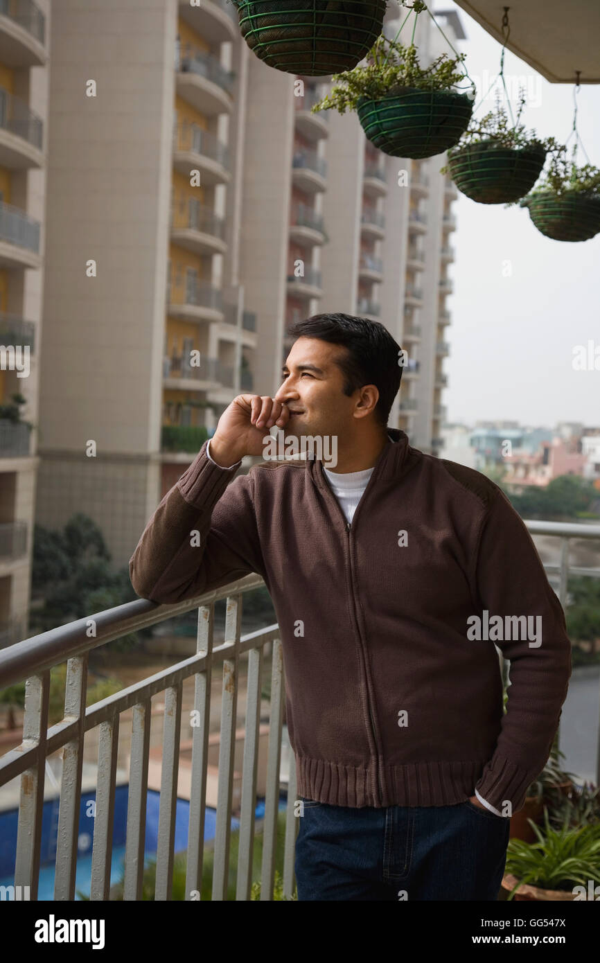 Man on a balcony hi-res stock photography and images - Alamy