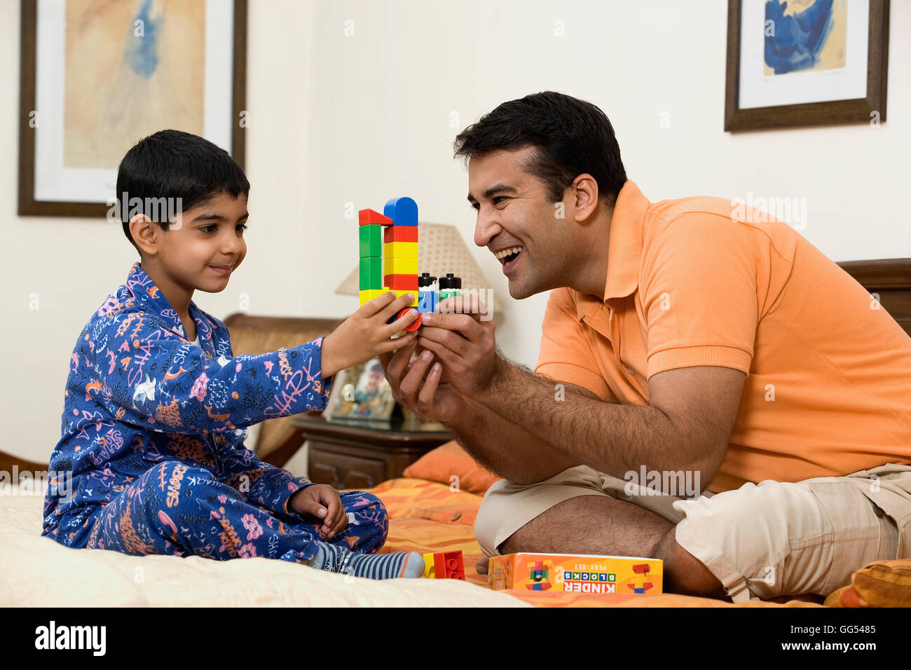 Father and son playing with toys Stock Photo - Alamy