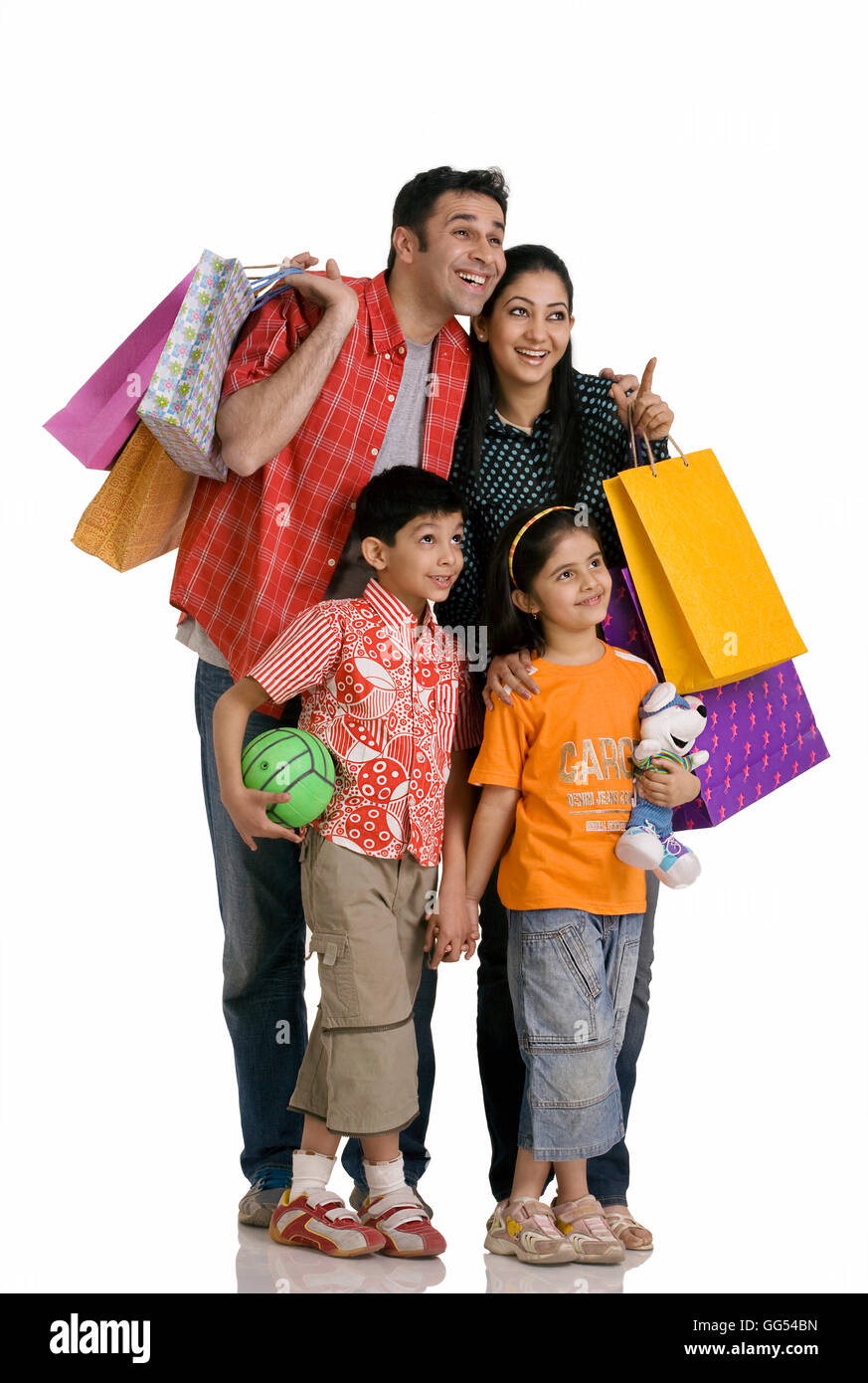 Family with shopping bags Stock Photo - Alamy