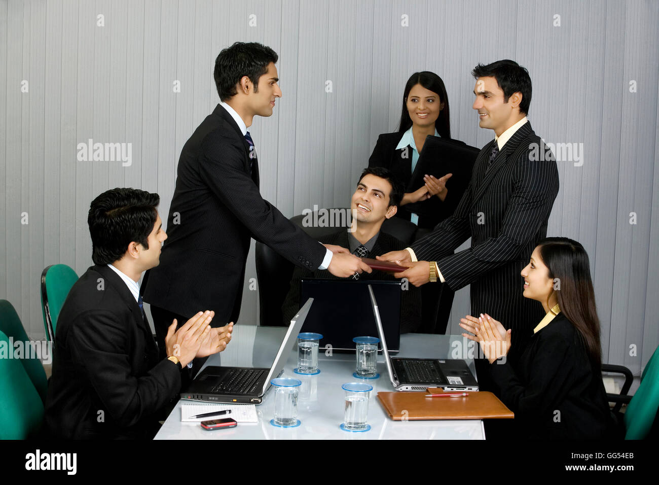 Business, handing a file hi-res stock photography and images - Alamy