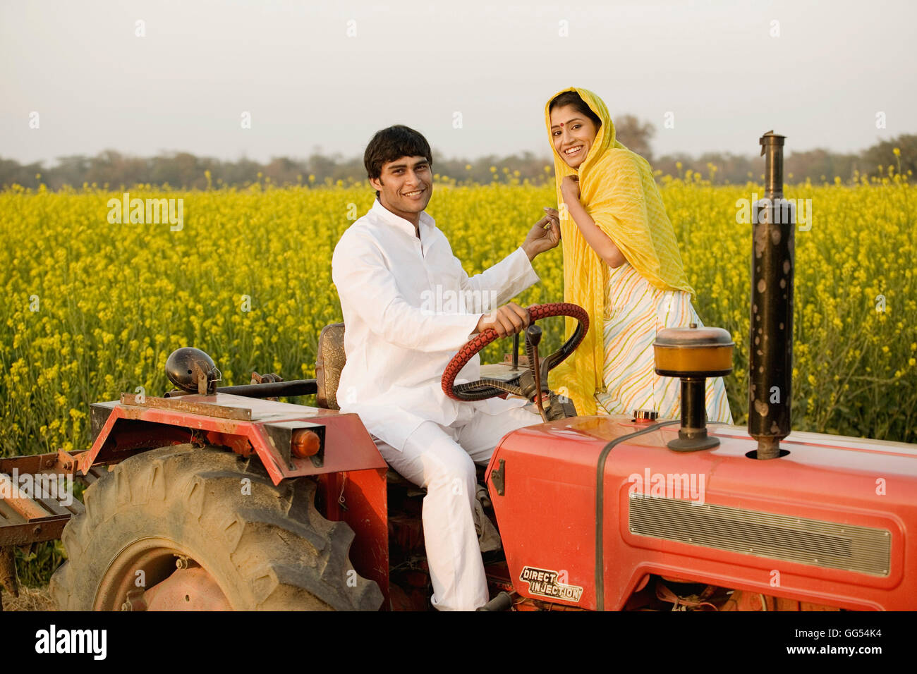 A rural couple on a tractor Stock Photo - Alamy