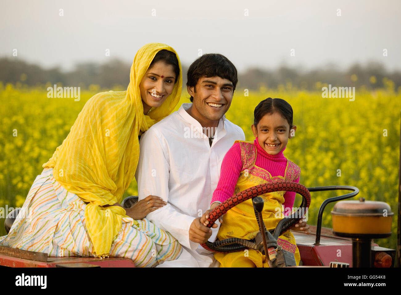 A typical rural family on a tractor Stock Photo - Alamy