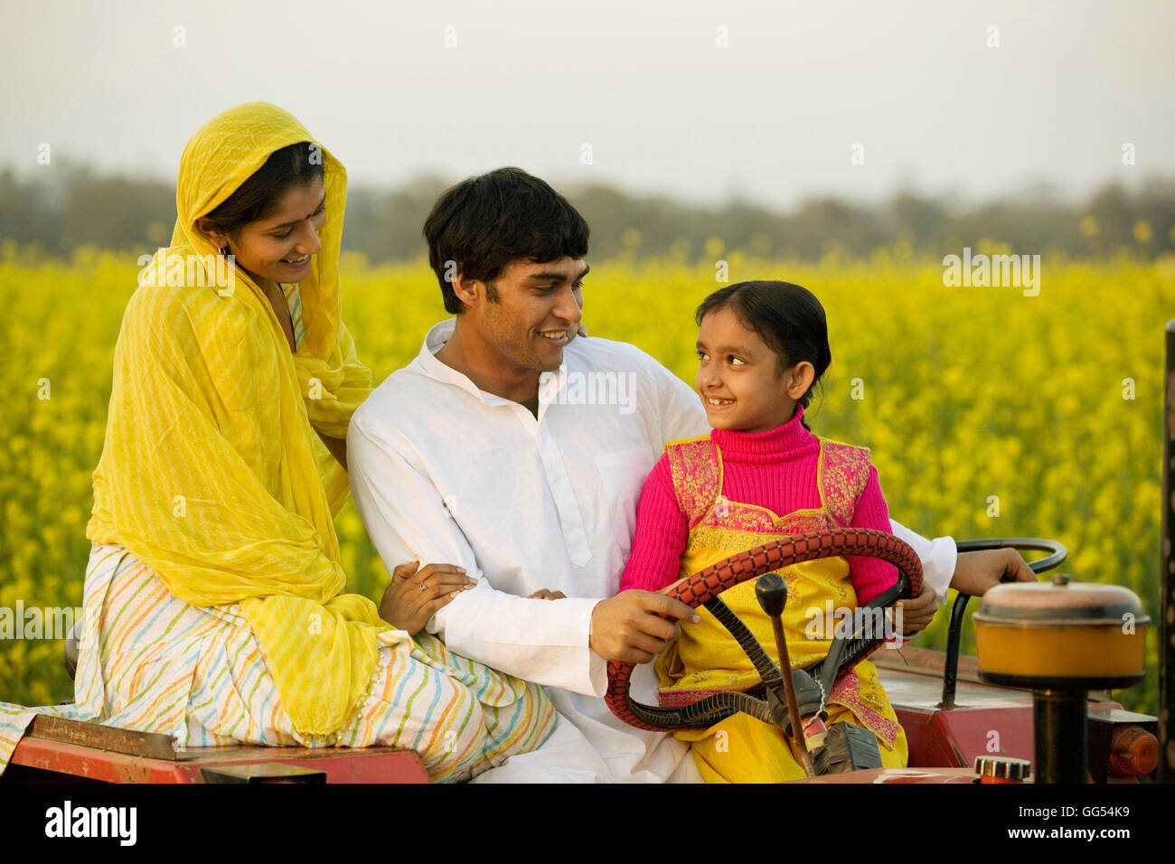 A typical rural family on a tractor Stock Photo - Alamy