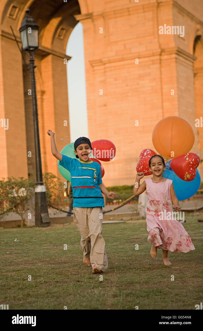Happy children running gate hi-res stock photography and images - Alamy