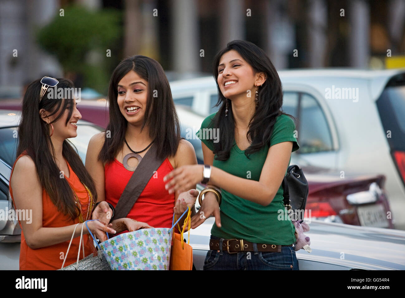 Girls standing in the parking area Stock Photo - Alamy