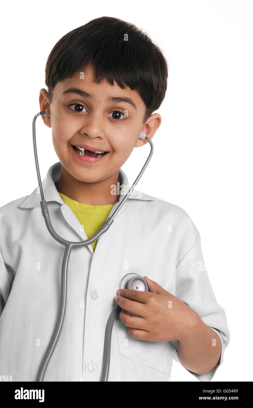 A boy wearing a doctor's coat Stock Photo - Alamy