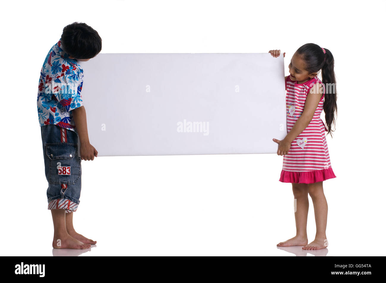 Children holding a whiteboard Stock Photo - Alamy