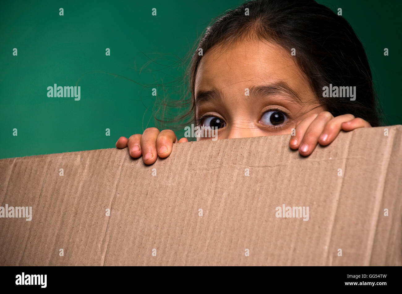 Girl peeking out cardboard box hi-res stock photography and images - Alamy