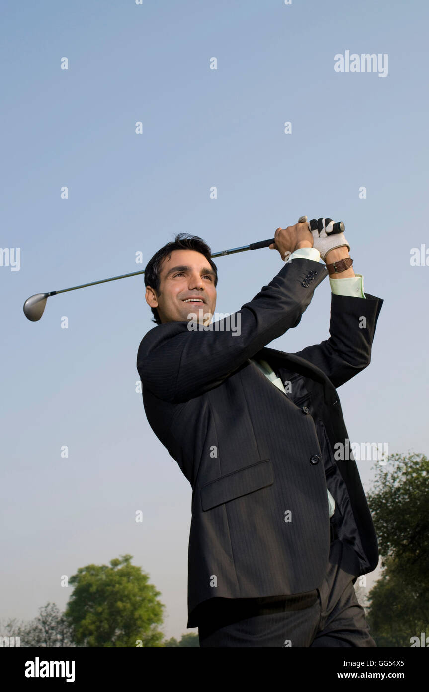 Business executive playing golf hi-res stock photography and images - Alamy