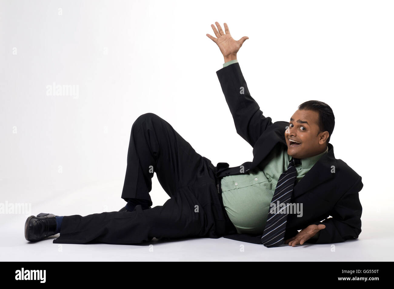 Executive raises a hand Stock Photo - Alamy