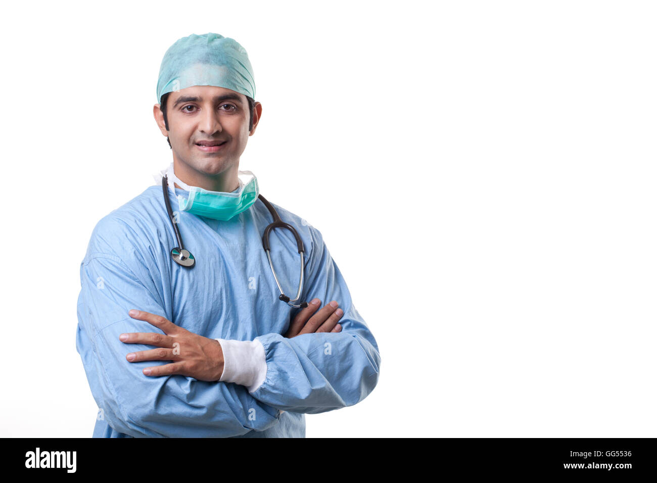 Handsome male surgeon smiling over white background Stock Photo - Alamy