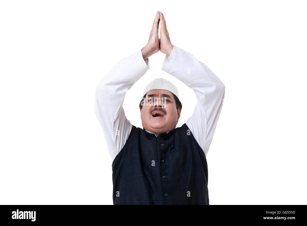 Male politician with hands raised Stock Photo - Alamy