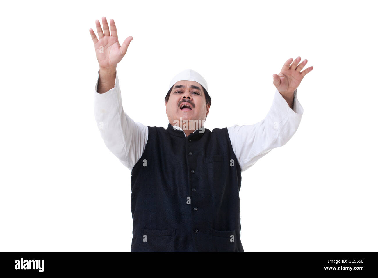Male politician with hands raised Stock Photo - Alamy