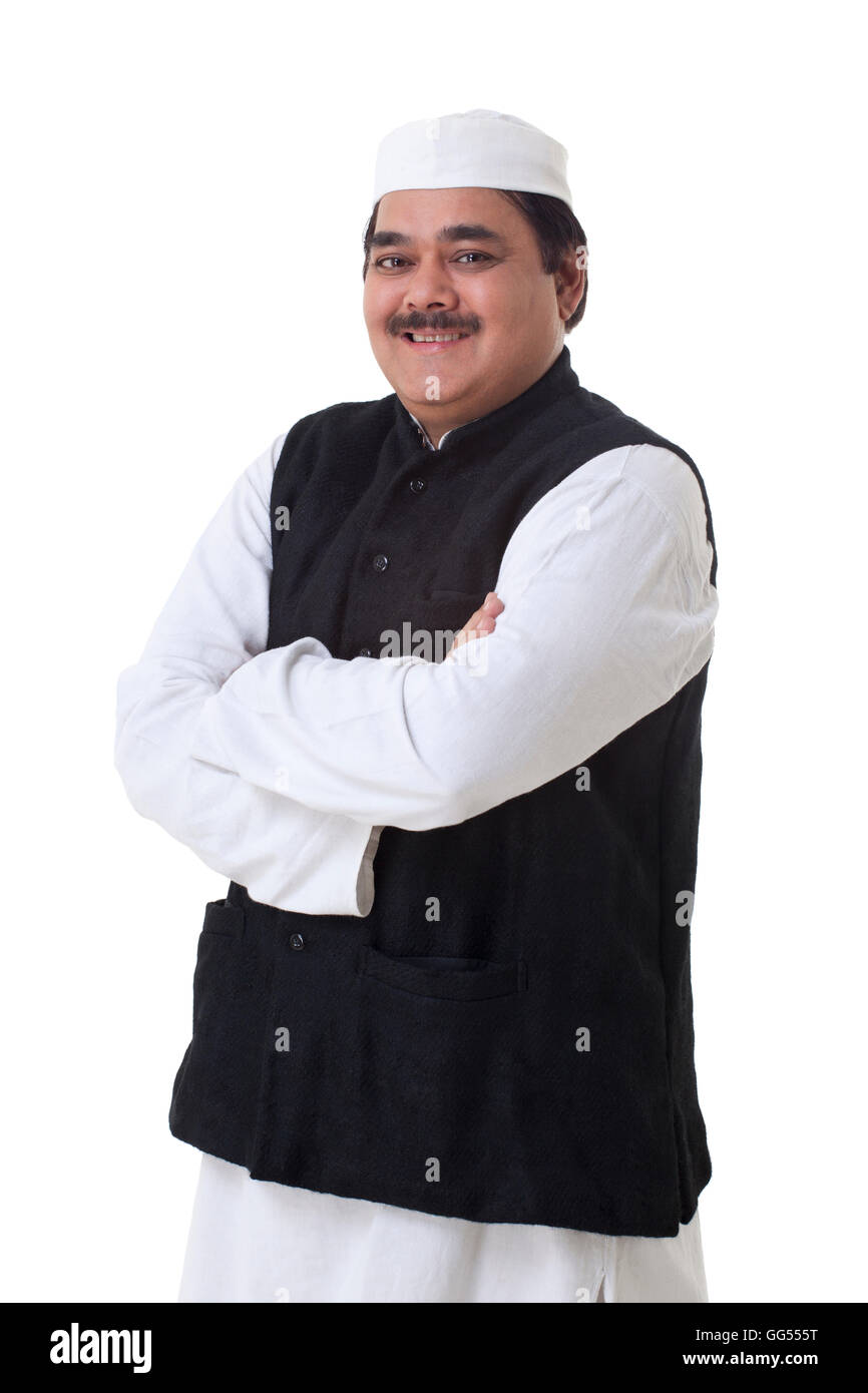 Portrait of smiling mature politician standing over white background ...