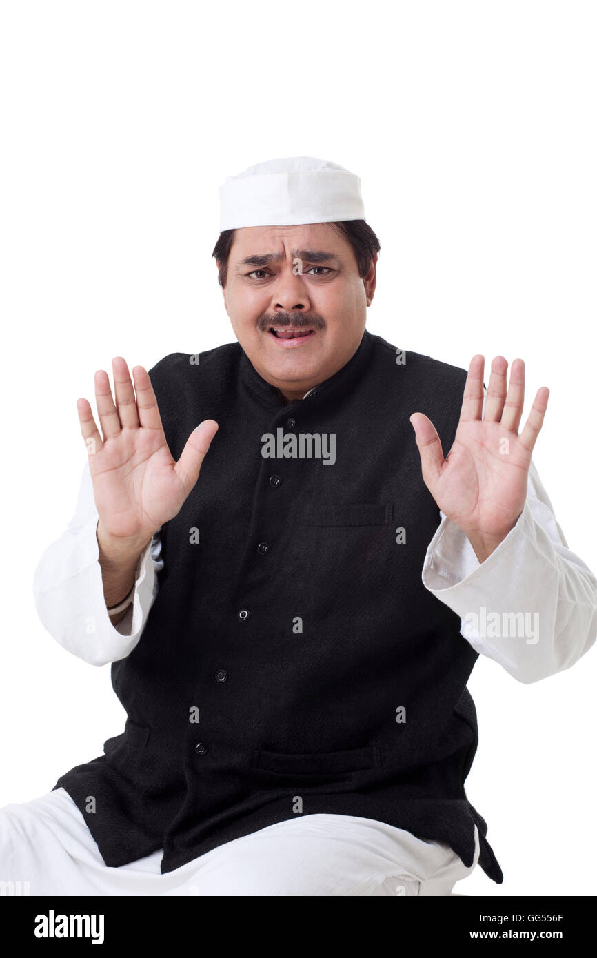 Politician gesturing and making face over white background Stock Photo ...