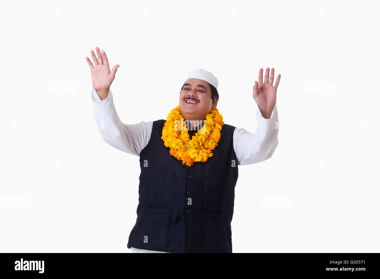 Happy politician with arms raised Stock Photo - Alamy