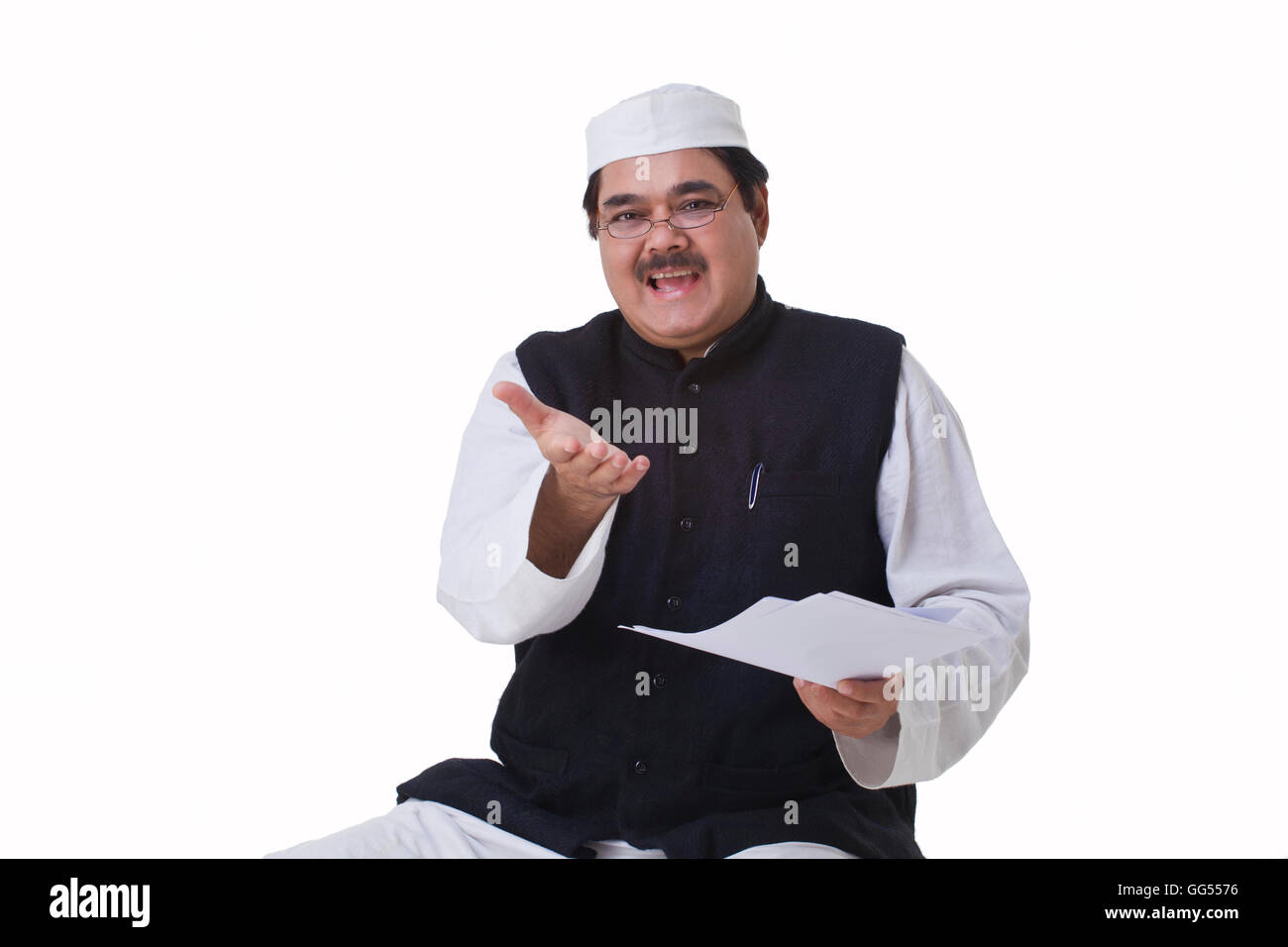 Politician in traditional clothes gesturing Stock Photo - Alamy