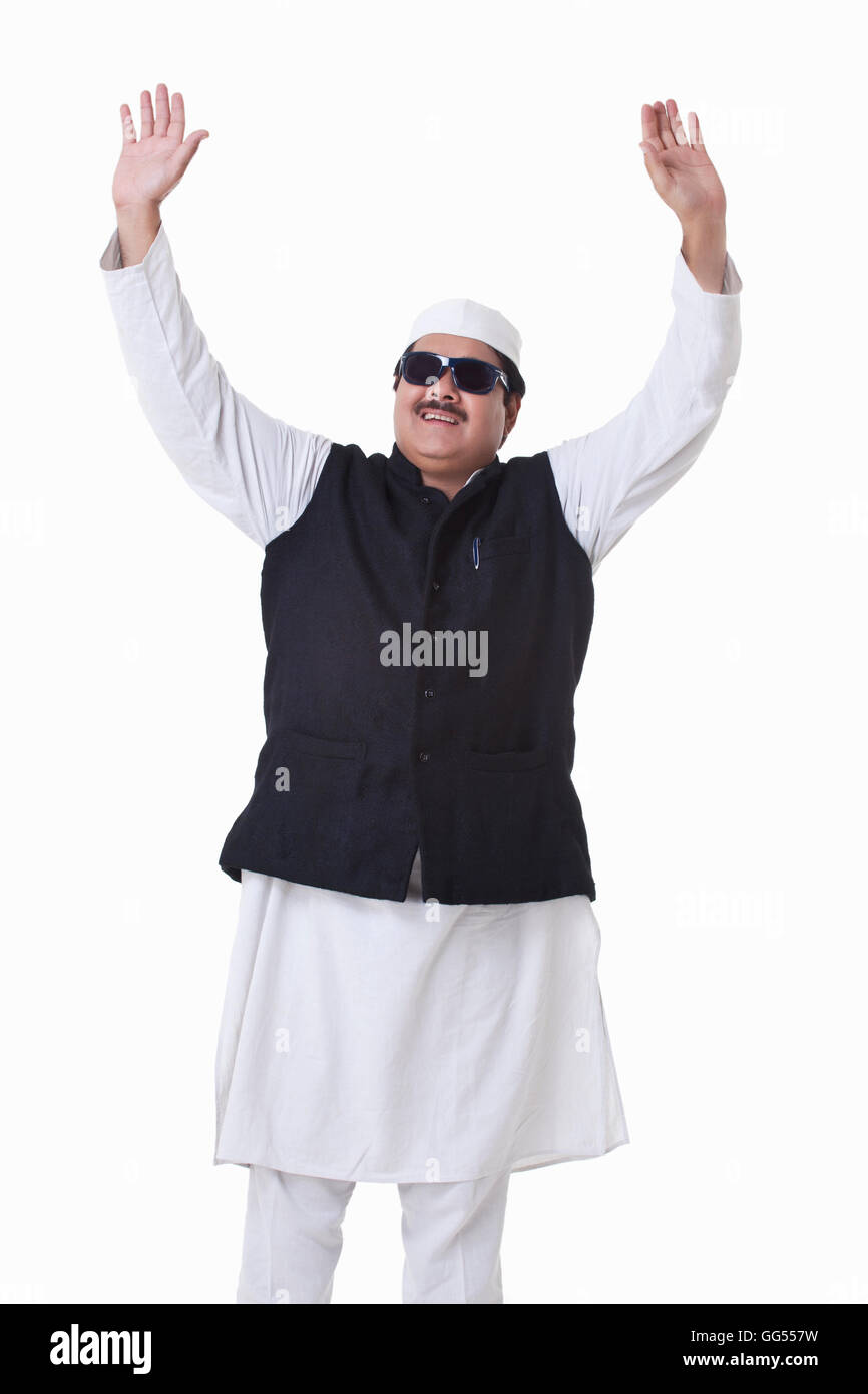 Politician standing with arms raised over white background Stock Photo ...