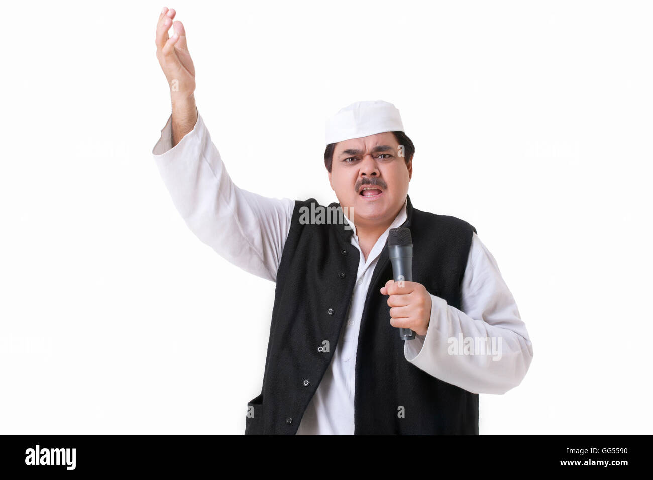 Male politician with microphone giving speech Stock Photo - Alamy