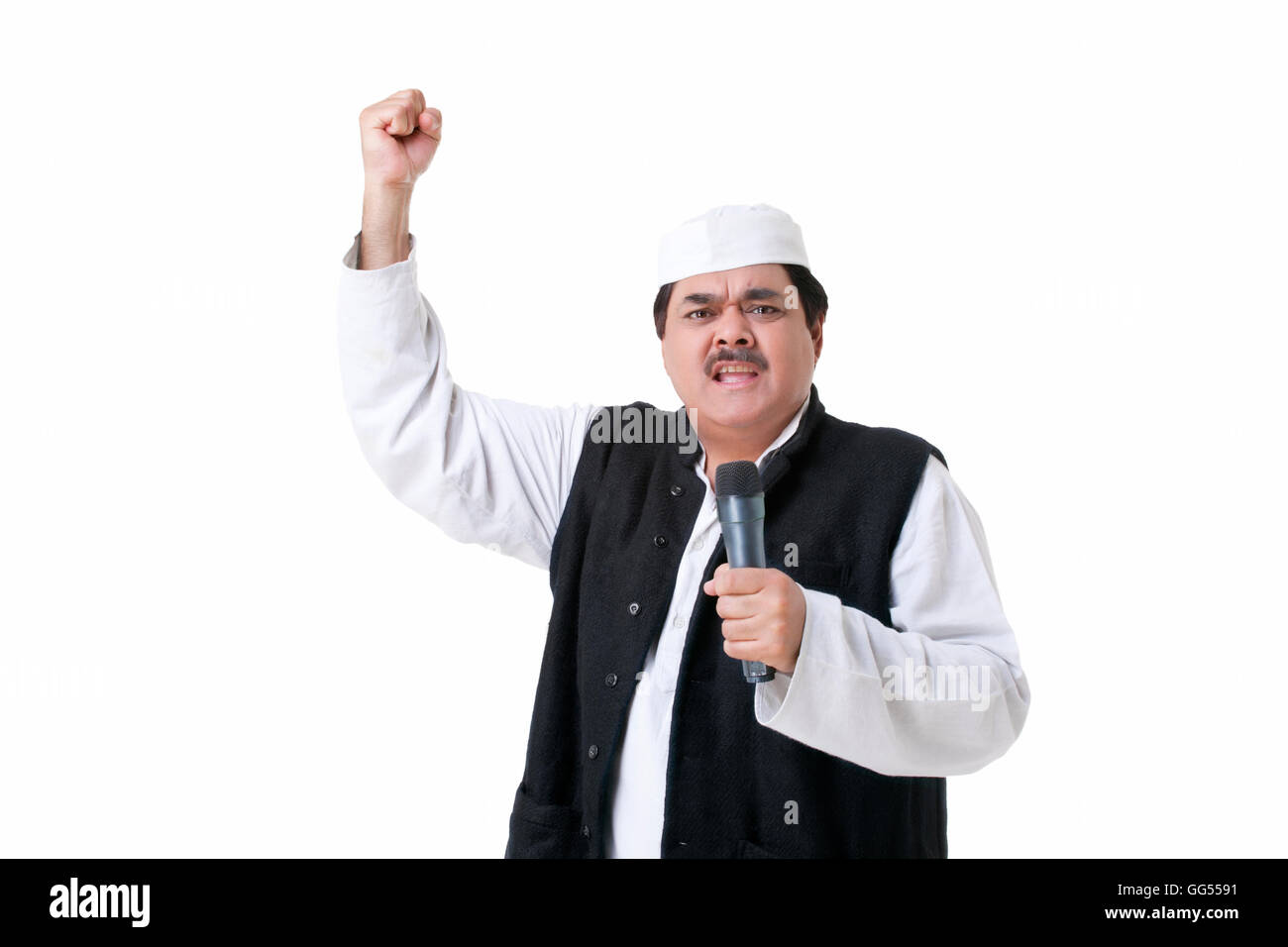 Male politician with microphone making a fist Stock Photo - Alamy