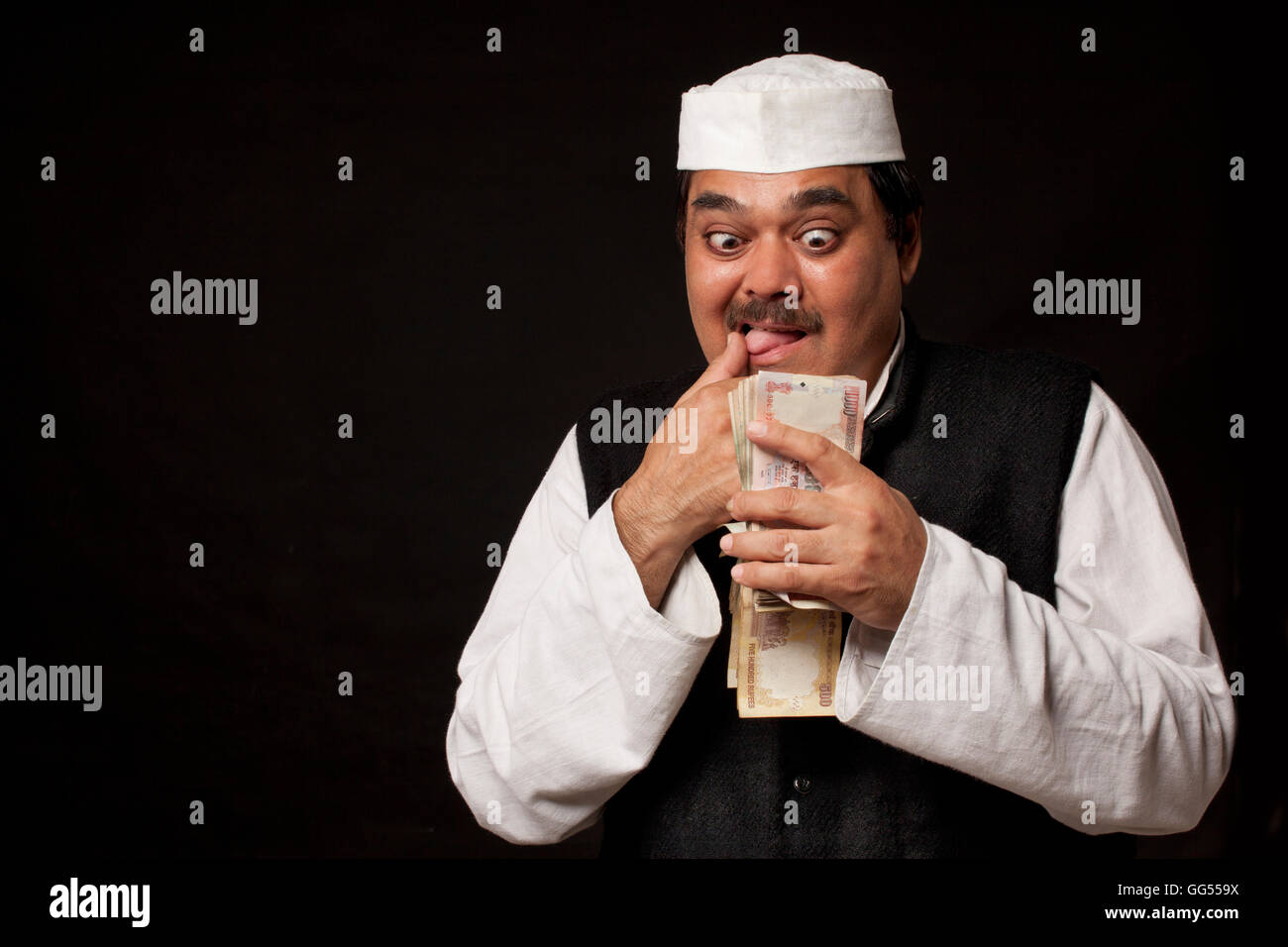 Greedy politician counting money Stock Photo - Alamy