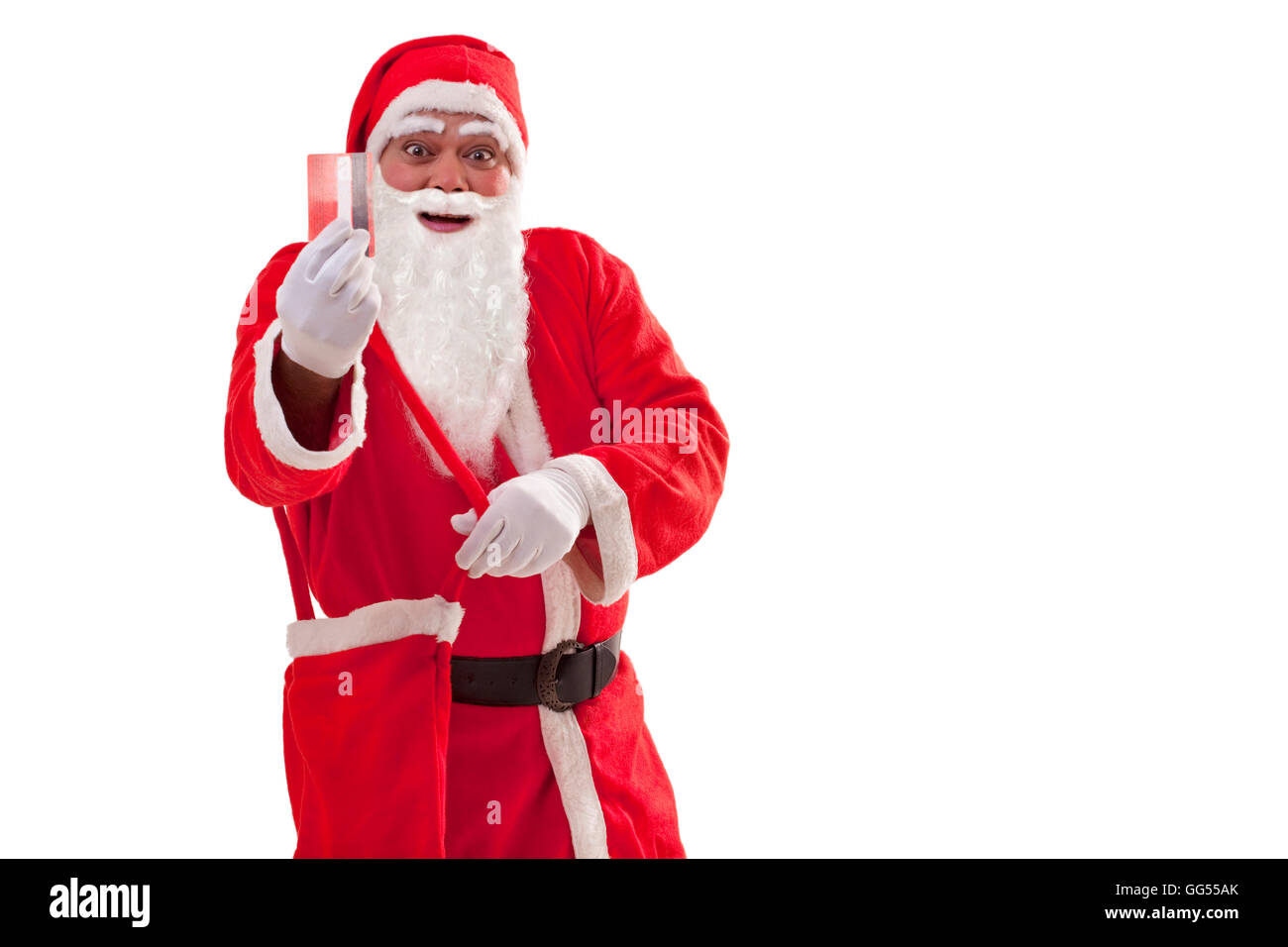 Portrait of smiling Santa Claus showing credit card over white ...