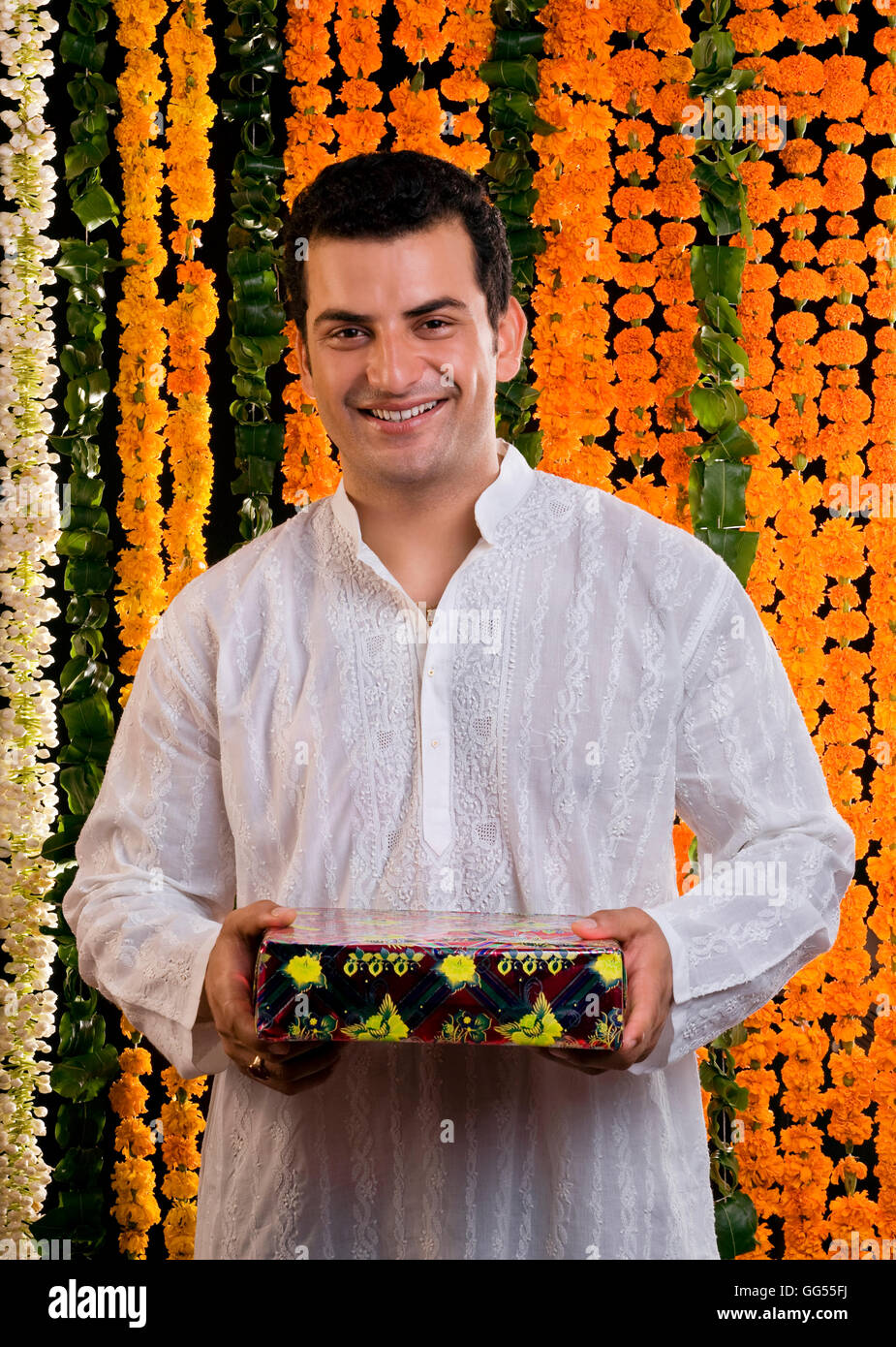 Man holding a present Stock Photo - Alamy