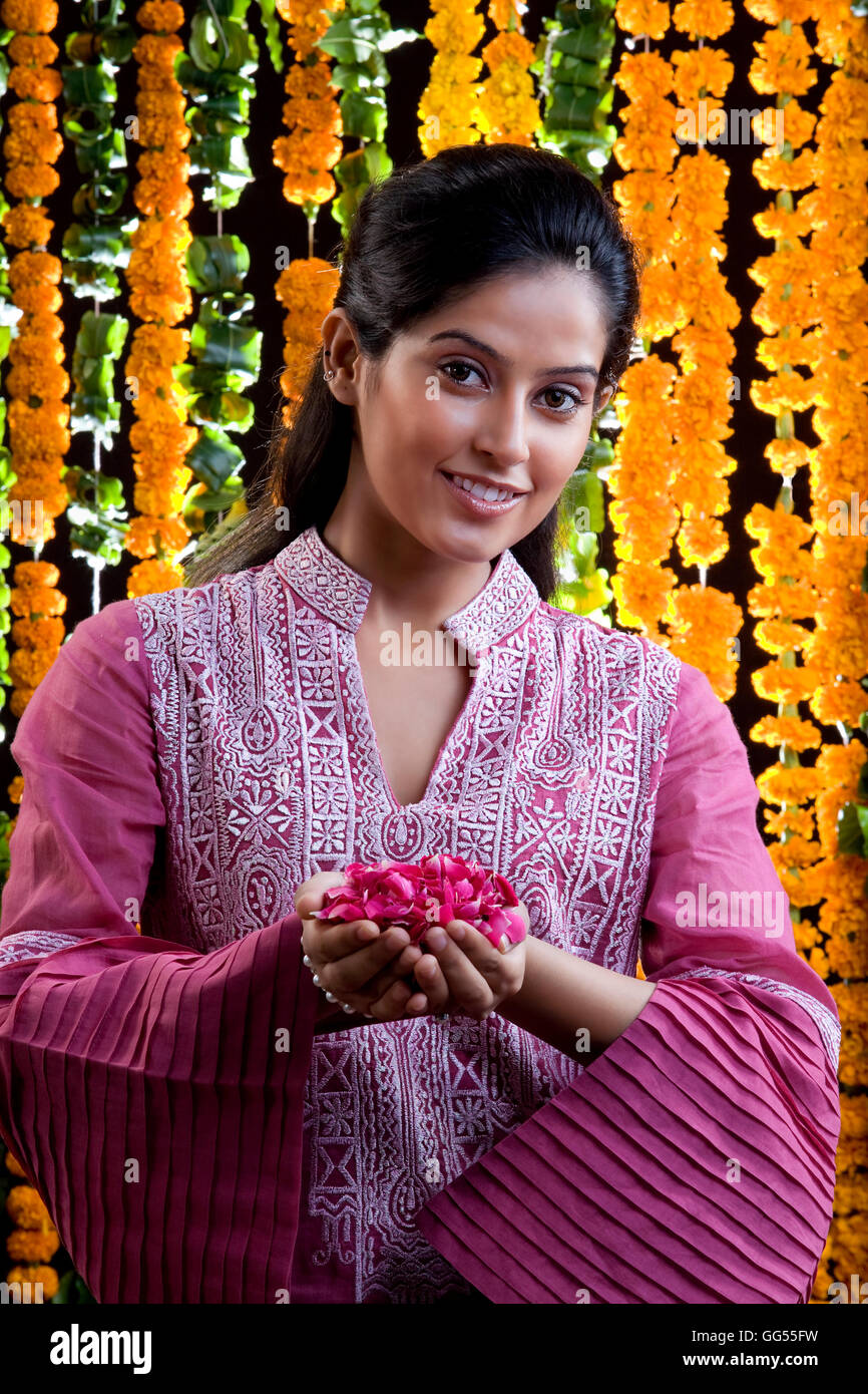 Woman offering flowers Stock Photo - Alamy
