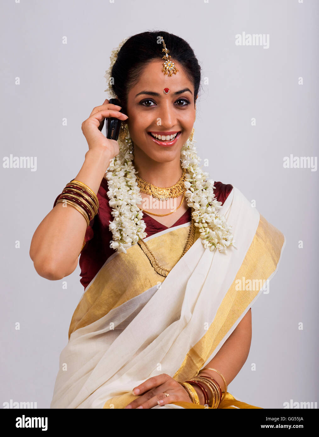 South Indian woman with cell phone Stock Photo - Alamy