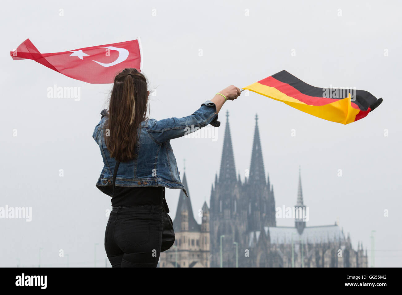 Woman holding german turkish flag hi-res stock photography and images ...
