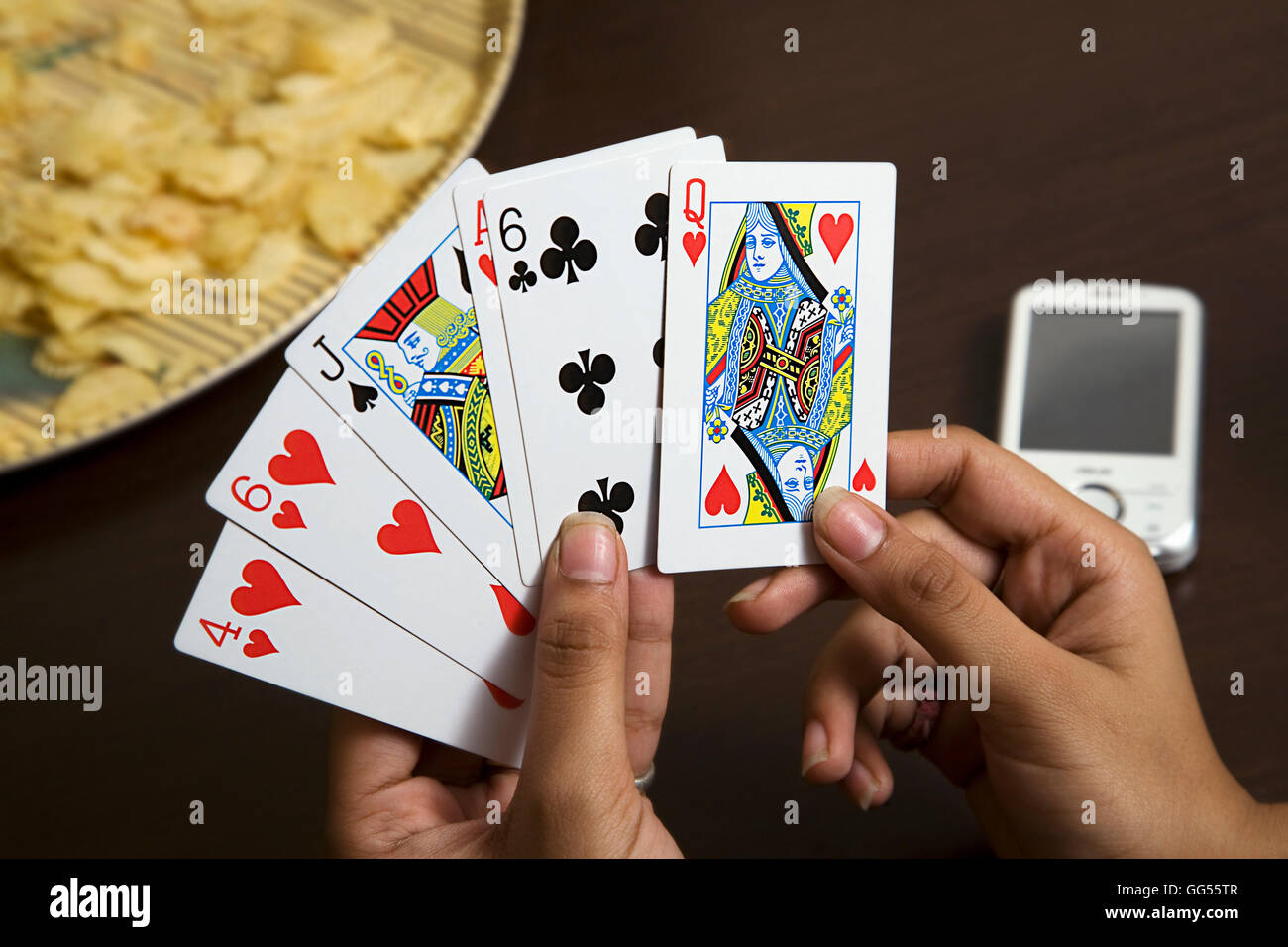 Woman playing cards Stock Photo - Alamy