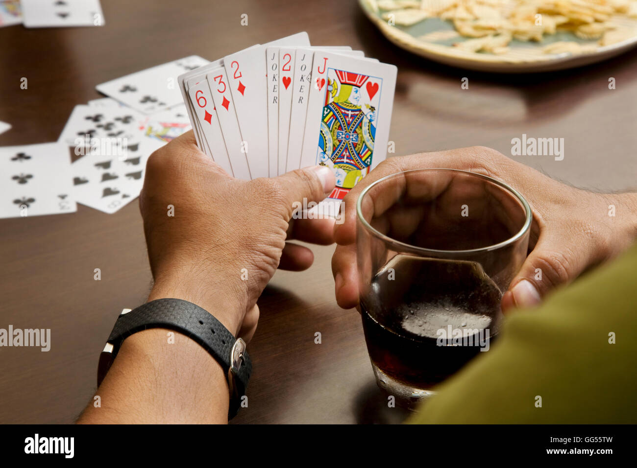 Man playing cards Stock Photo - Alamy