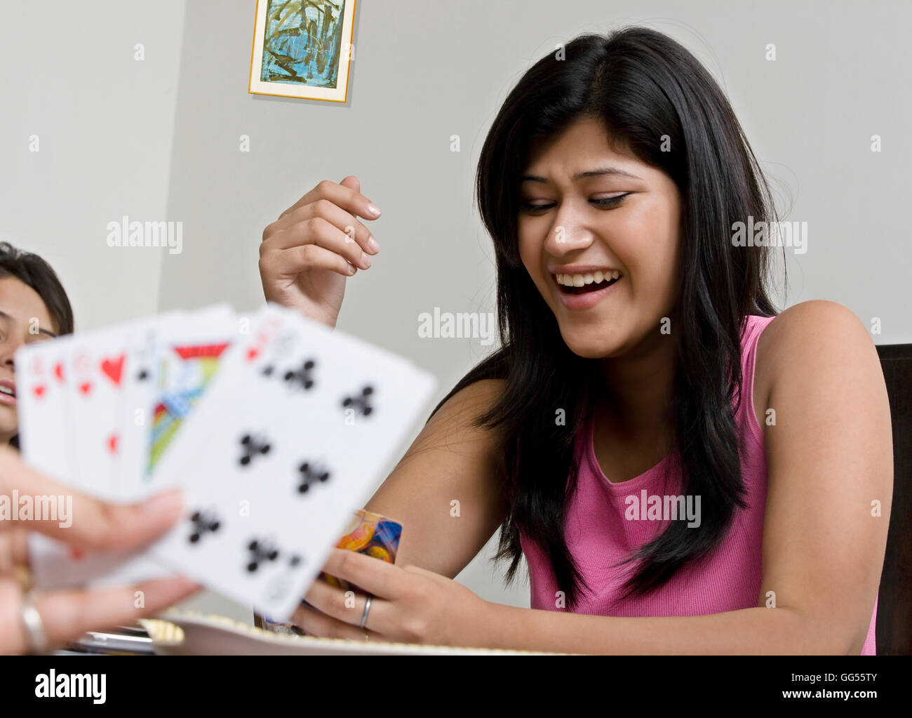 Friends playing cards Stock Photo - Alamy