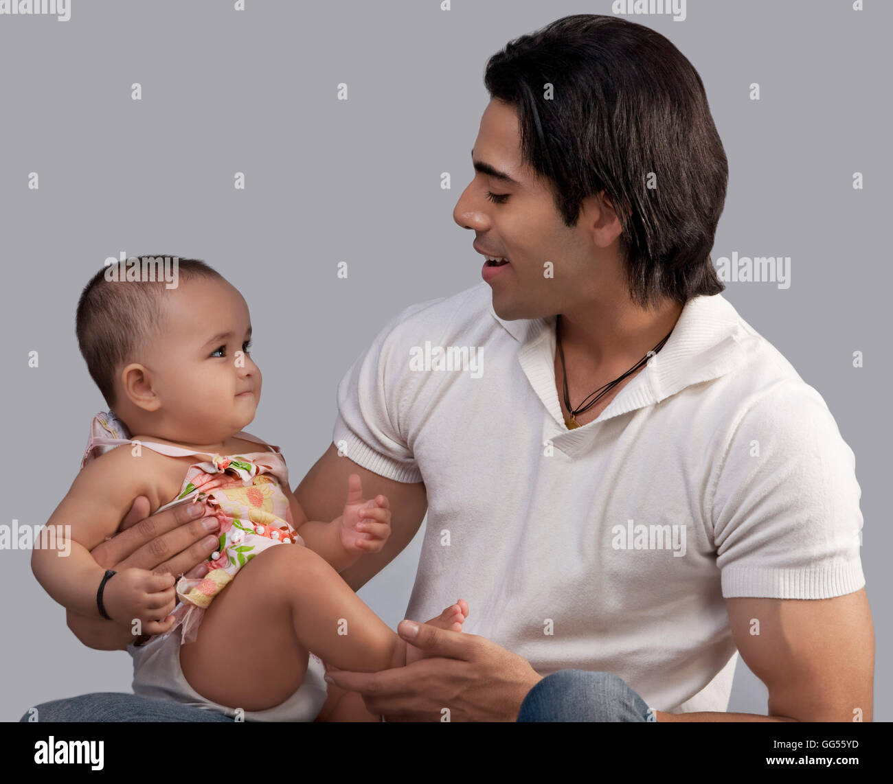 Man with a baby Stock Photo - Alamy