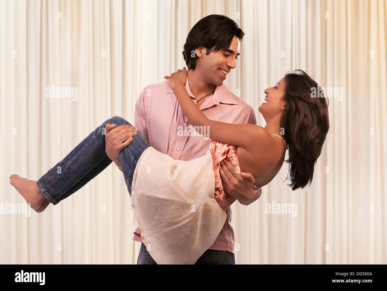 Man carrying a woman Stock Photo - Alamy