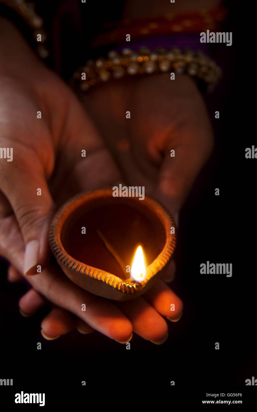 Hands holding a diya Stock Photo - Alamy