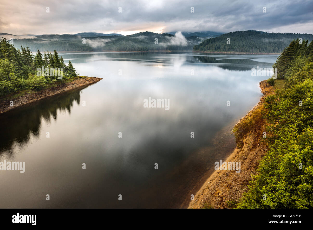 Landscape with lake Oasa at sunset, in Romanian Carpathians Stock Photo ...