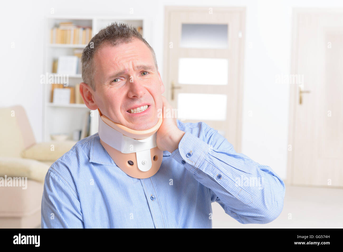 Man with a surgical cervical collar suffering from neck pain Stock ...