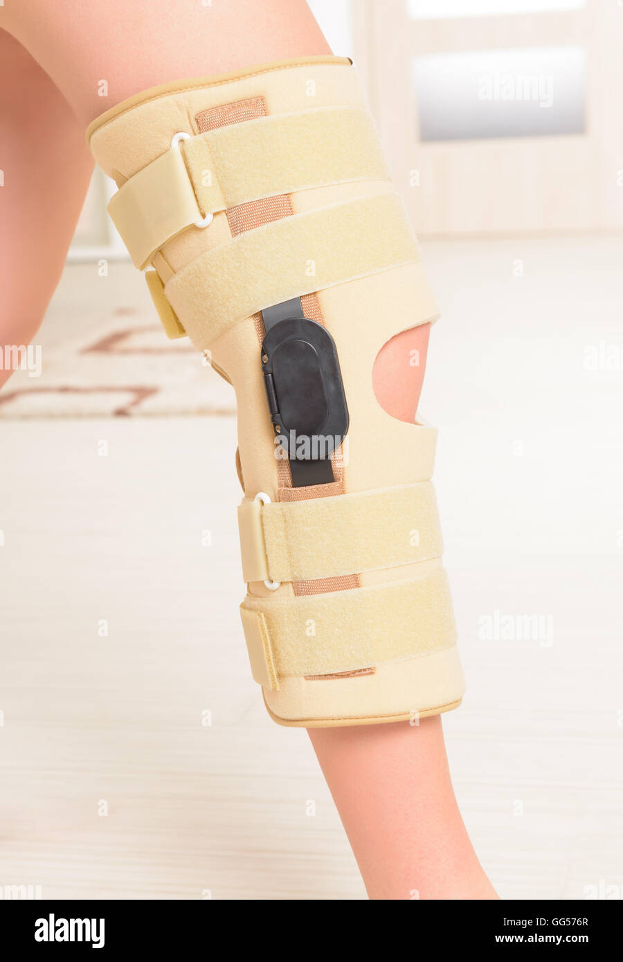 Woman's leg in knee cages for stabilization and support Stock Photo - Alamy